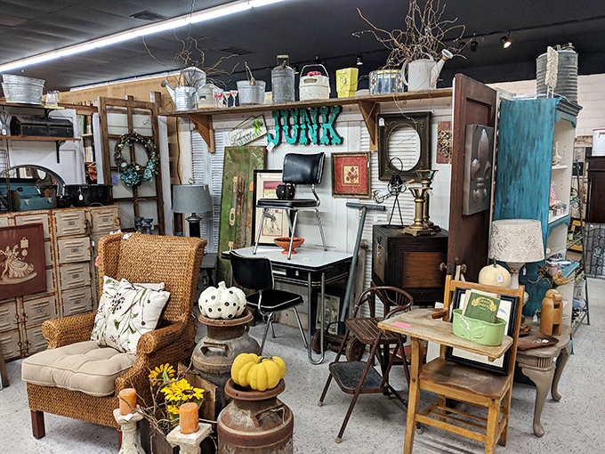 Farmhouse meets vintage office in this perfectly styled vignette. The wicker chair, vintage desk, and seasonal pumpkins create an autumn aesthetic that's timeless rather than trendy.