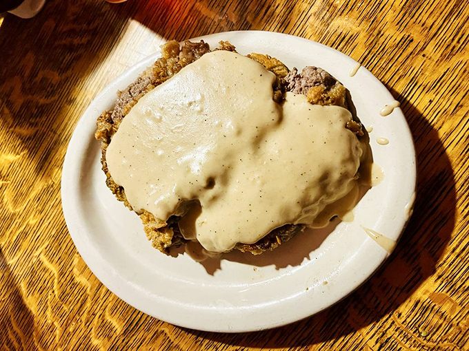 Chicken fried steak swimming in gravy&mdash;because sometimes you need a dish that requires both a fork and a life preserver.