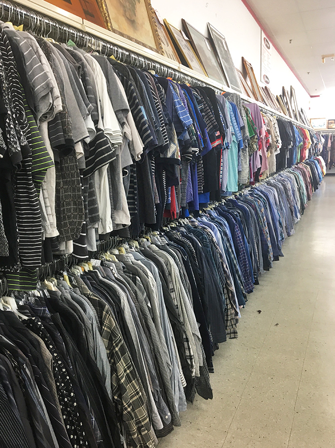 Men's shirts arranged with military precision. A rainbow of options that would make any capsule wardrobe enthusiast weak at the knees.
