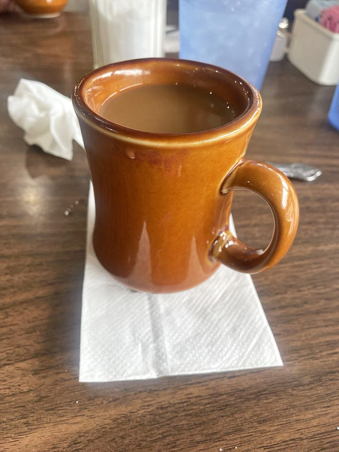 The coffee comes in mugs thick enough to withstand nuclear winter &ndash; served hot, strong, and without pretentious origin stories about the beans.