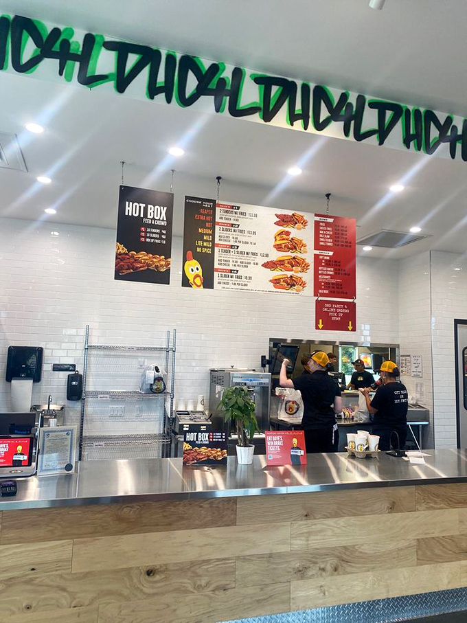 Behind this counter, culinary magic happens daily as the team transforms simple chicken into the spicy sensation that's worth crossing state lines for.