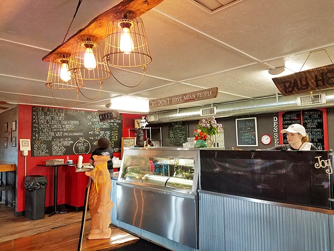 The counter where barbecue dreams come true, complete with industrial lighting that somehow makes everything feel both rustic and right.
