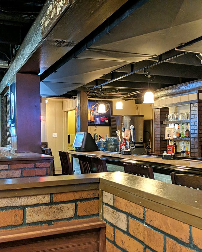The bar area maintains the rustic theme while promising cold drinks. Those wooden beams have witnessed countless "I shouldn't, but I will" moments.