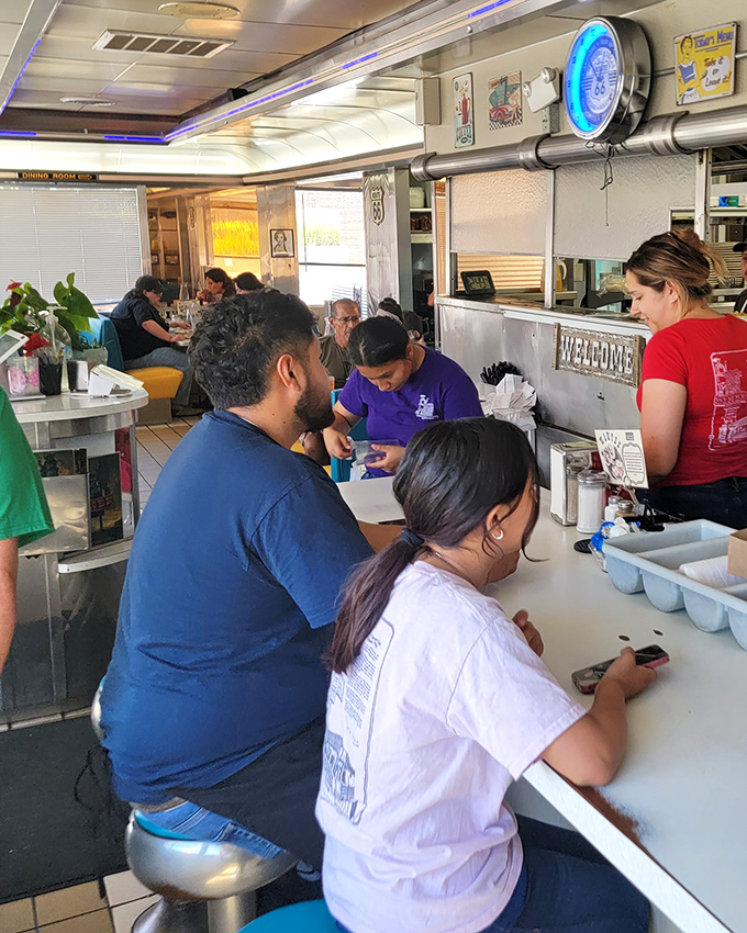 The counter seating&mdash;where strangers become temporary neighbors and the rhythm of short-order cooking becomes the soundtrack to your meal. 