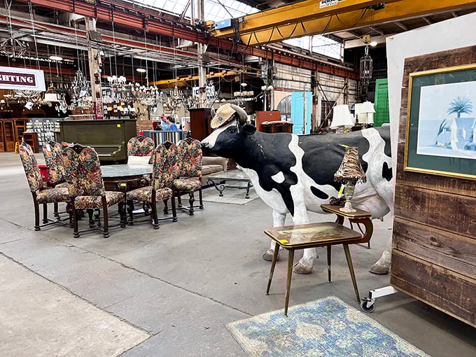 Nothing says "conversation piece" quite like a life-sized cow statue grazing between vintage chairs&mdash;the ultimate answer to "what's missing from my dining room?"