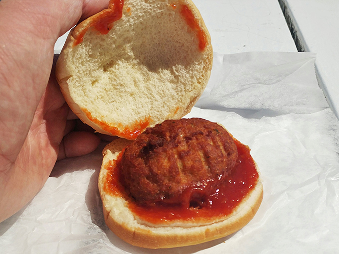 The humble crab cake sandwich&mdash;where Maryland tradition meets Delaware execution in a handheld celebration of Atlantic seafood excellence.