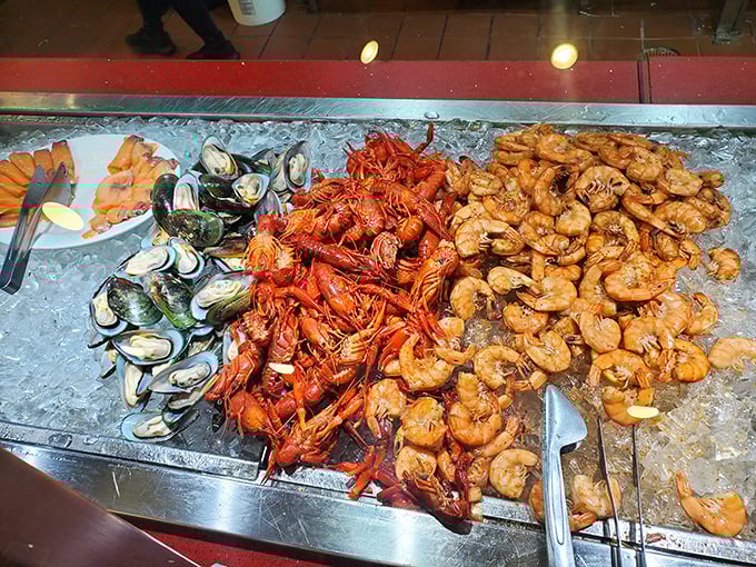 A trio of ocean treasures on ice: green-lipped mussels, crawfish, and peel-and-eat shrimp&mdash;like Neptune's jewelry box opened for public viewing.