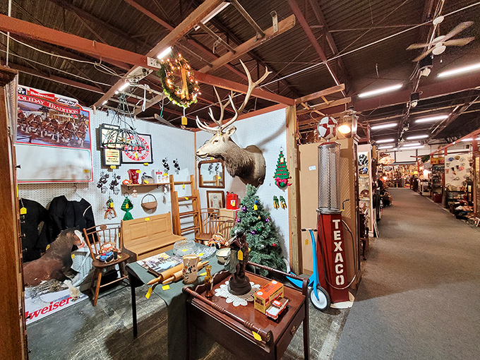 The hunting lodge aesthetic meets Christmas cheer in this booth where a mounted deer watches over your shopping decisions.
