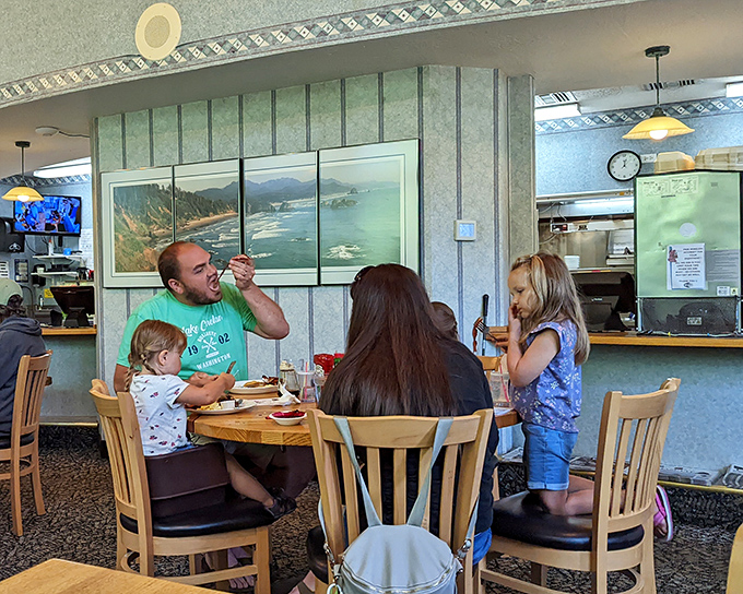 Family breakfast moments that become core memories. That coastal artwork isn't just decoration&mdash;it's a preview of your post-pancake adventure.