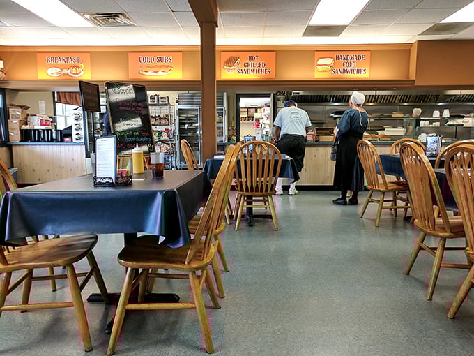 The dining area balances simplicity with warmth&mdash;wooden chairs that have heard thousands of satisfied "mmms" and tables that have supported countless memorable meals.