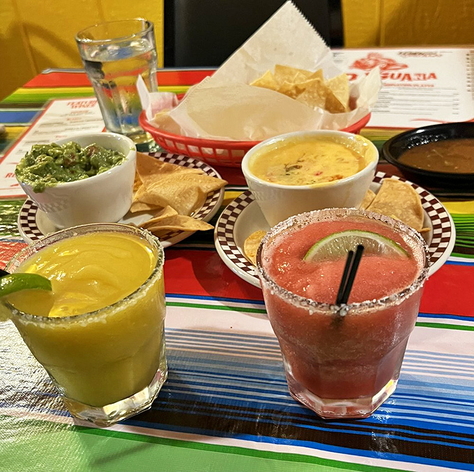 Margaritas in vibrant colors that promise to turn an ordinary Tuesday into a celebration. The salt rim isn't optional &ndash; it's essential wisdom.