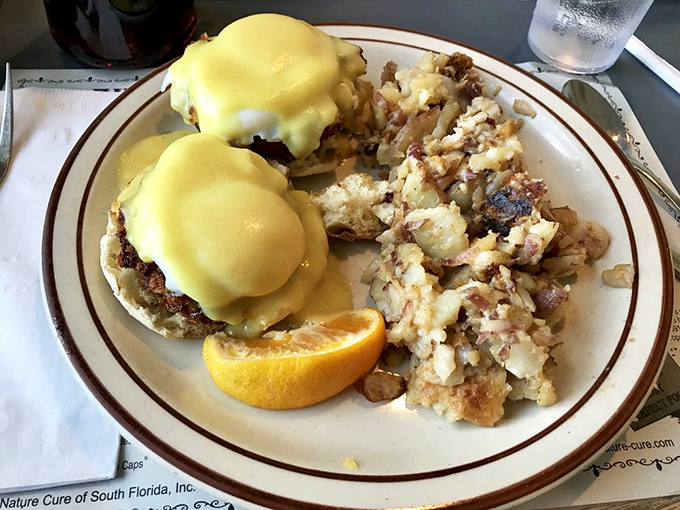 Eggs Benedict with hollandaise so sunny it could brighten even Monday mornings, accompanied by home fries that demand equal attention.