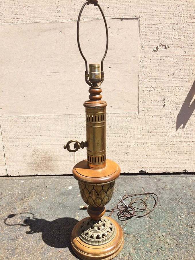 A brass lamp base showcases the kind of craftsmanship that made lighting fixtures conversation pieces rather than afterthoughts.