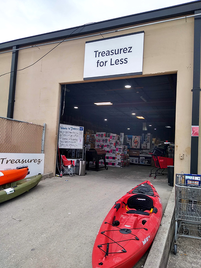 The entrance to Treasurez For Less&mdash;where kayaks greet you like red plastic welcome wagons to this bargain hunter's paradise.