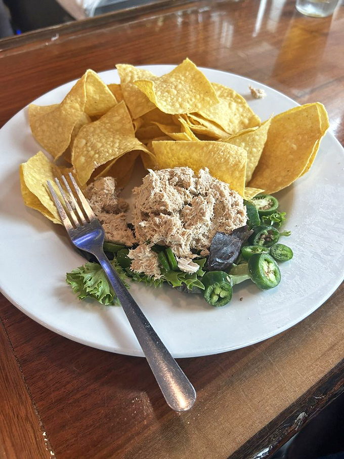 The fish dip paired with tortilla chips creates that perfect symbiotic relationship—like peanut butter and jelly, but with a Gulf Coast accent.