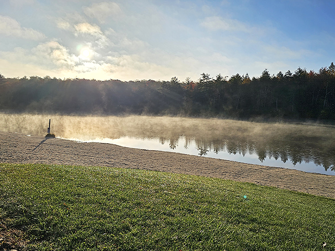 Morning mist performs its daily magic show across the lake, turning an ordinary sunrise into a moment worthy of framing.