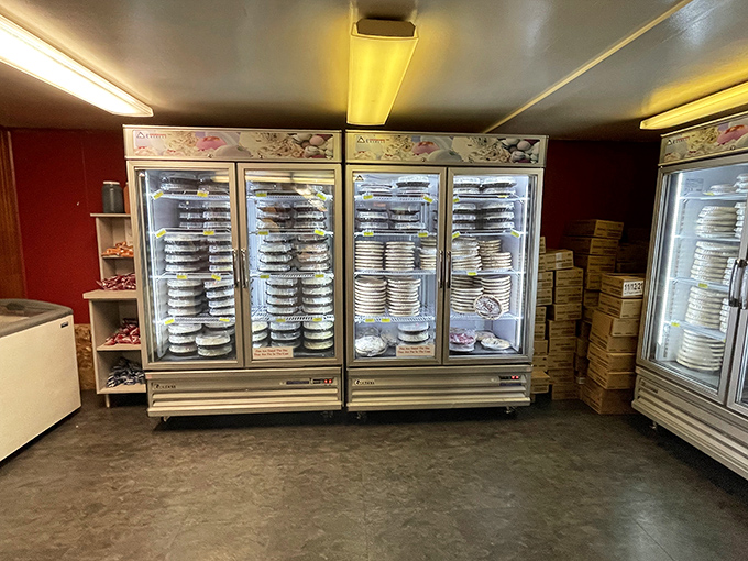 The refrigerated pie display—Winchester's version of the Louvre. Each glass door reveals masterpieces more tempting than the Mona Lisa.