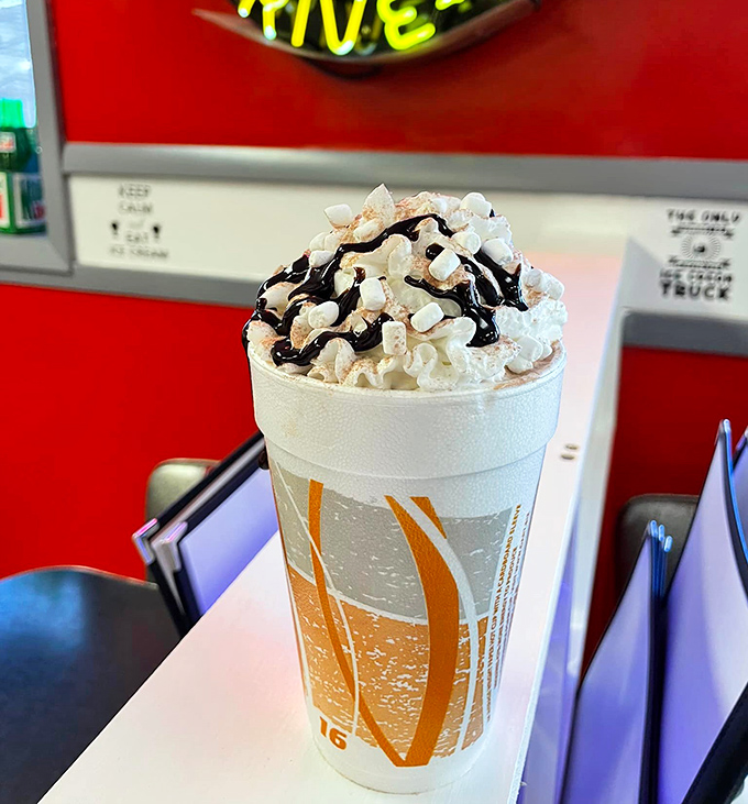 A mountain of whipped cream atop a chocolatey avalanche. This isn't just a shake&mdash;it's what happiness would look like if it took liquid form.