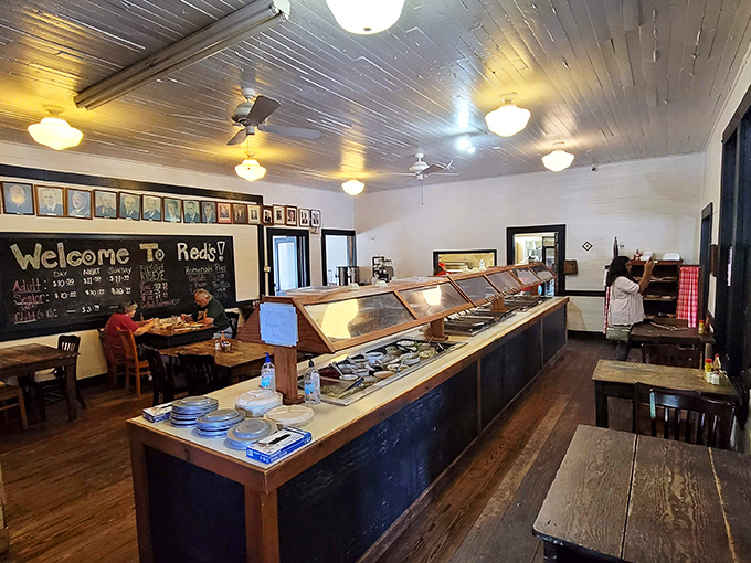 The buffet line stretches like a runway of Southern delights, with the chalkboard welcome sign promising a meal that's worth every mile of your journey.