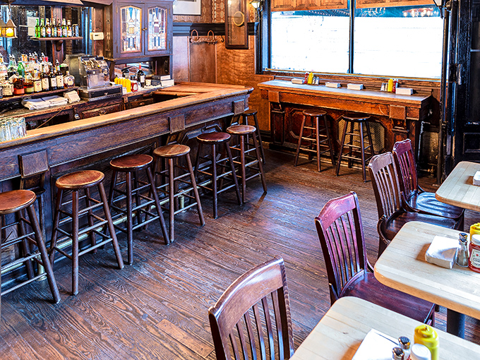 Wooden charm and no-nonsense seating say, "We care about the food, not the furniture." The stage is set for burger magic.