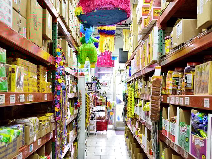 Pi&ntilde;atas and party supplies hang overhead like festive stalactites in this cave of wonders for celebration planners.
