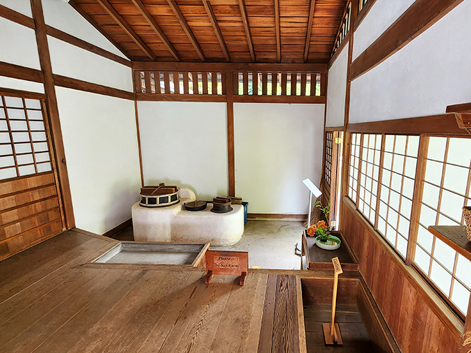 The kitchen space whispers stories of meals prepared with reverence, where every utensil has its place and purpose.