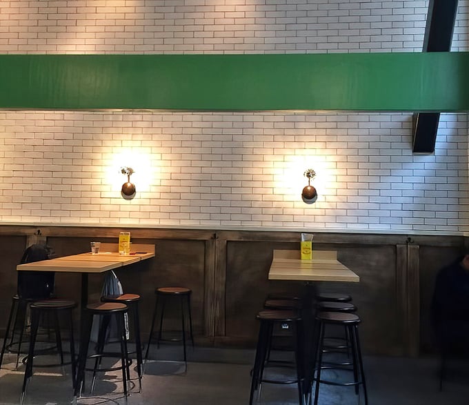 Minimalist seating that says, "We know why you're here, and it's not for the furniture." Fair enough.