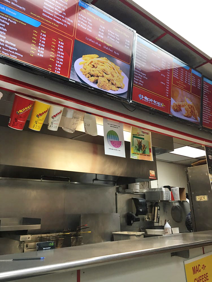 Behind the scenes where the magic happens. Those digital menu boards are like modern art installations celebrating fried perfection.