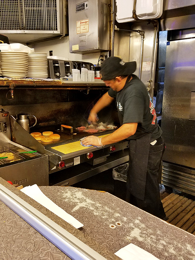 The ballet of burger-making happens here, where skilled hands perform the same beautiful choreography they've perfected over decades.