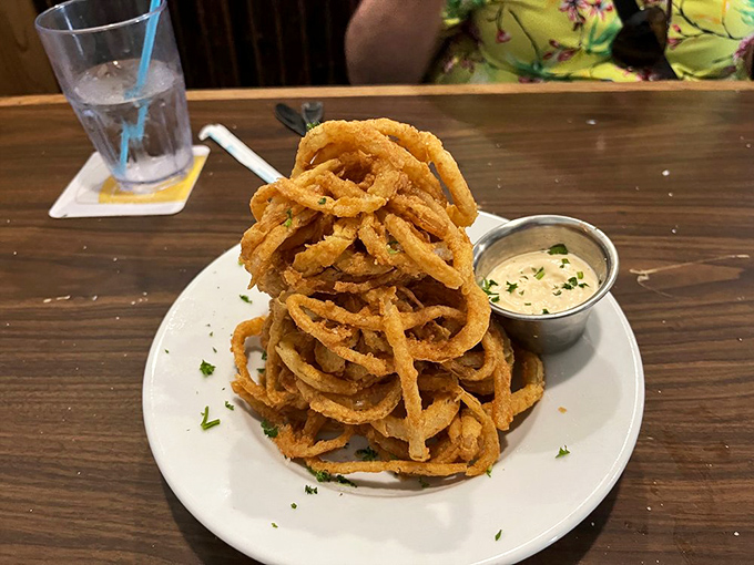 Onion rings stacked higher than a Florida condo development&mdash;crispy, golden monuments to the art of simple pleasures done extraordinarily well.
