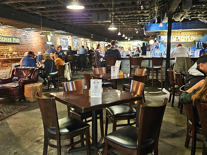 Wooden chairs, exposed brick, and the buzz of conversation. This isn't just a themed restaurant; it's a community living room with better beer.