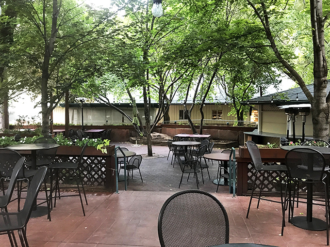 The patio feels like dining in an enchanted forest, where mountain breezes season your meal and trees provide nature's ceiling.