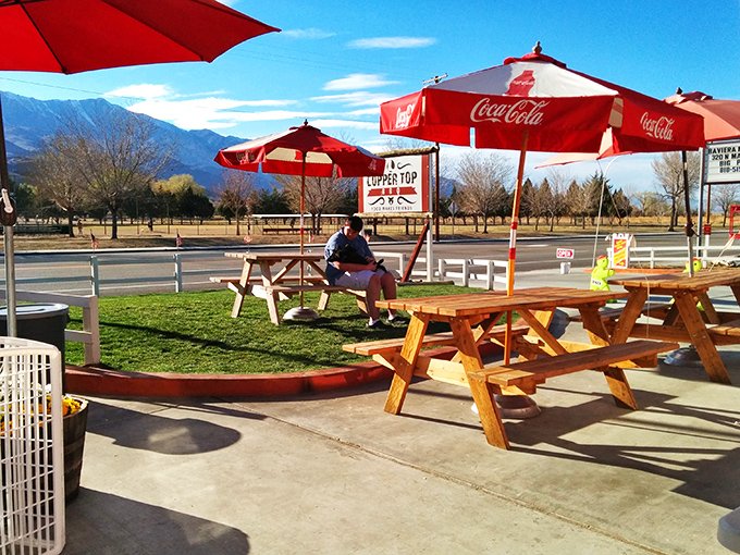 The outdoor seating area frames the Sierra Nevada mountains perfectly, because great barbecue deserves an equally impressive backdrop.