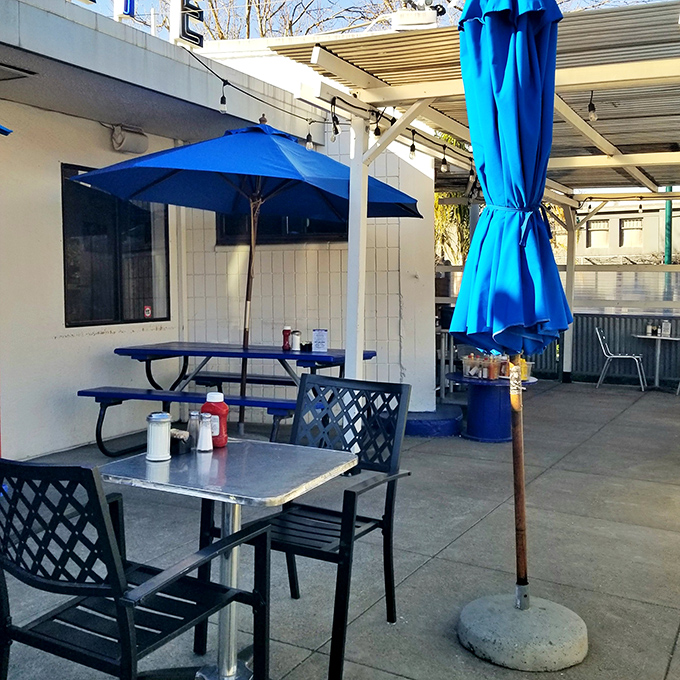 Al fresco dining with those signature blue umbrellas&mdash;because sometimes pancakes taste better with a side of sunshine and fresh air.