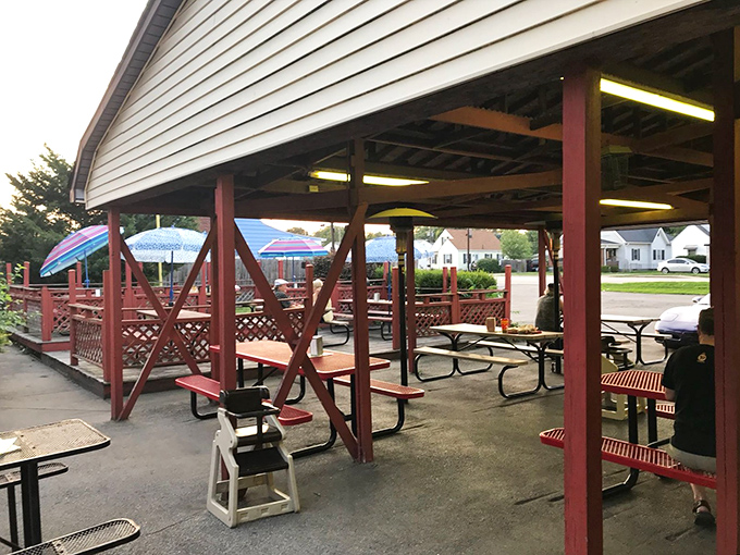 The covered patio offers al fresco dining with a side of small-town charm – picnic tables where racing fans and locals have swapped stories for decades.