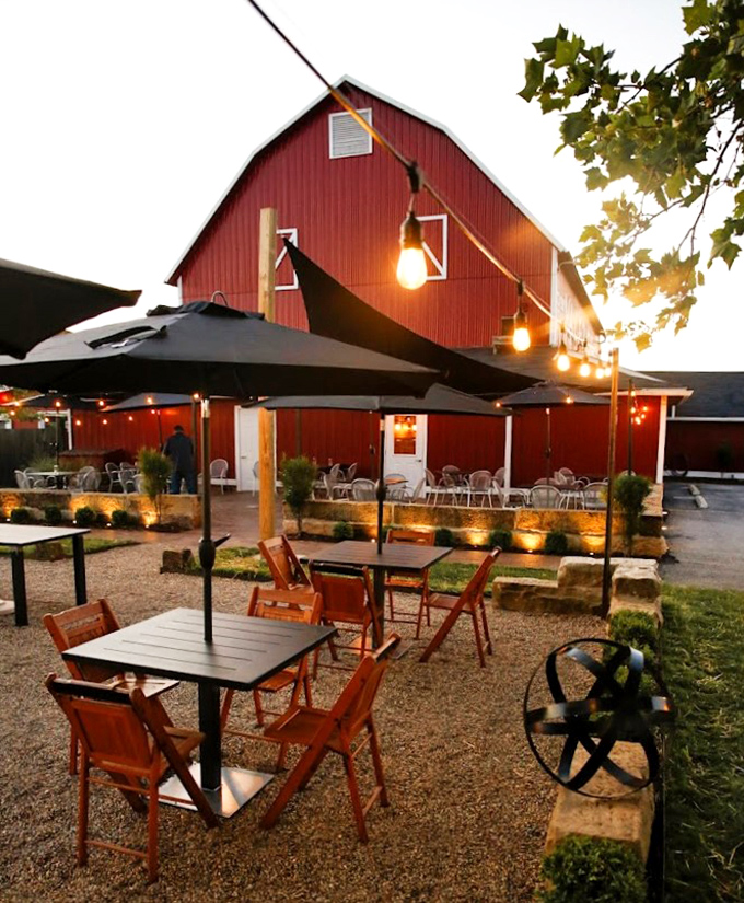 Al fresco dining with string lights transforming a simple barn exterior into Ohio's answer to a Tuscan evening&mdash;just add prime rib.