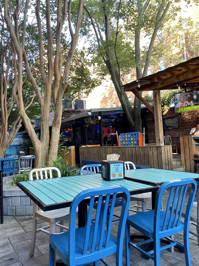 The outdoor patio offers a slice of Charleston heaven&mdash;dappled sunlight through trees, turquoise tables, and the promise of tacos.
