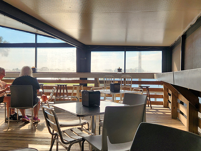 Screened-in patio seating: where Florida's natural beauty and air conditioning find their perfect compromise.