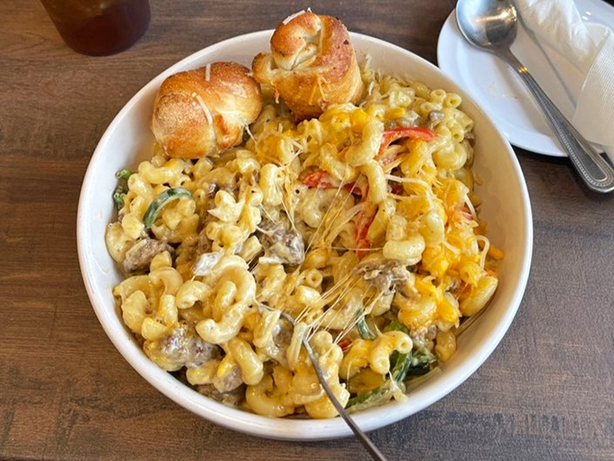 Mac and cheese elevated to an art form with Philly steak elements throughout. Those garlic knots perched on top are like the cherry on a savory sundae.