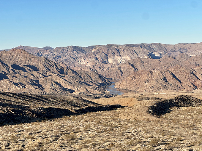 Desert meets water in a landscape that makes you question whether you're still on Earth or have stumbled onto a movie set.