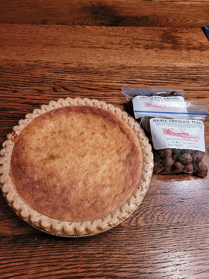 Homemade pie that looks like it's posing for a Norman Rockwell painting. The golden crust practically whispers, "You know you want a slice."