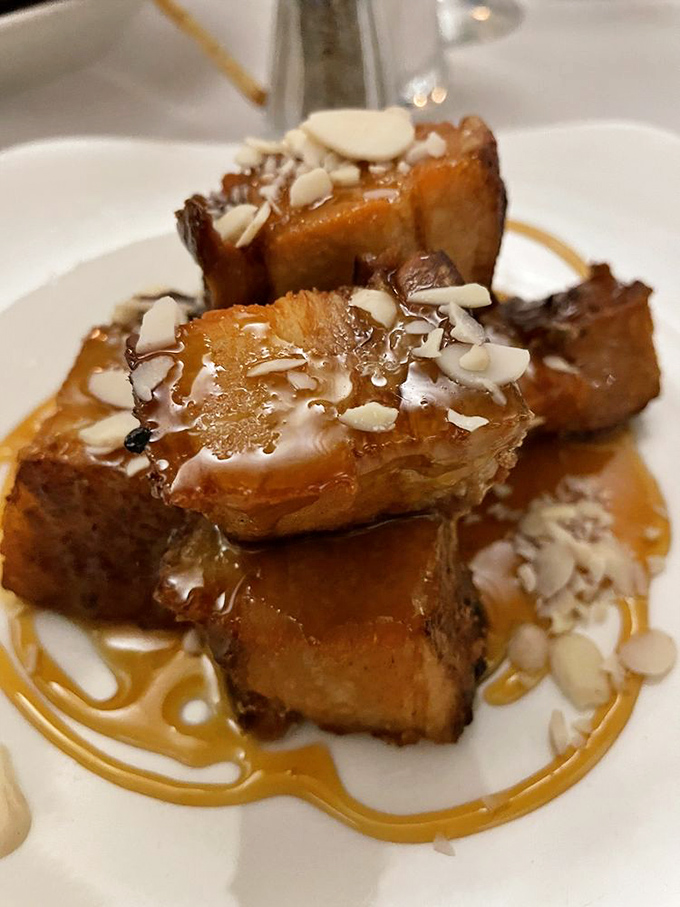 Pork belly that's had a luxurious caramel spa treatment, topped with almonds that add just the right crunch to this decadence party.