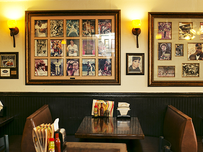 Not just photographs—a hall of fame celebrating those who recognized greatness. These booths have hosted everyone from neighborhood regulars to visiting celebrities seeking authentic Atlanta.