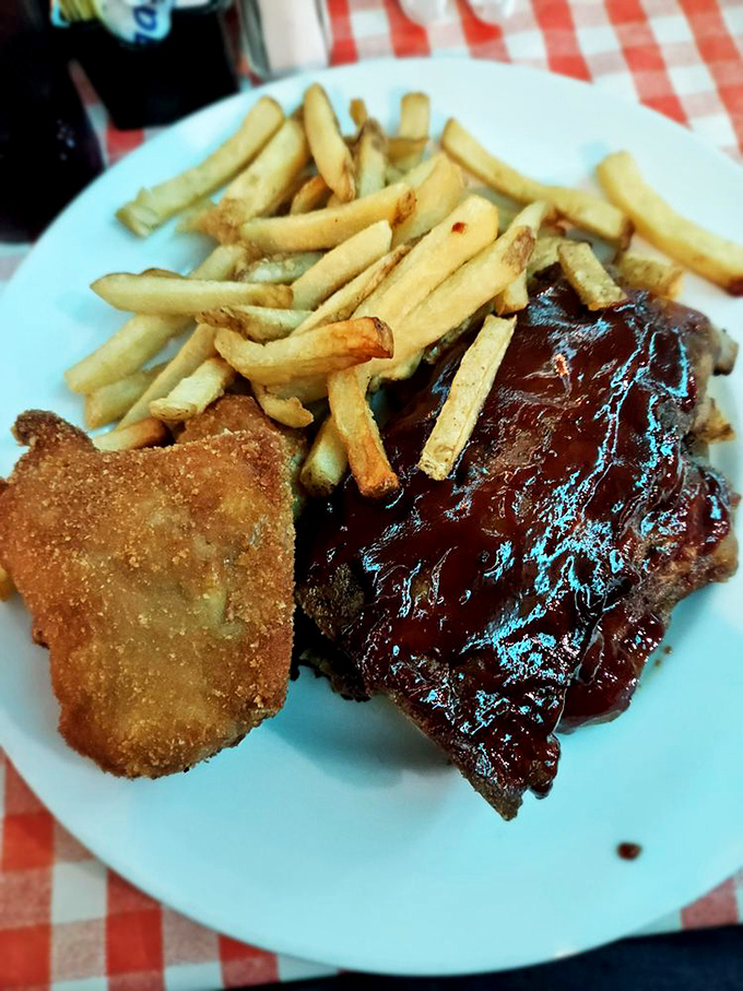 Ribs glazed with sauce so shiny you could check your reflection while deciding which delicious morsel to devour next.