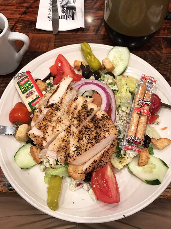 A salad that actually makes you forget you wanted a burger. Those perfectly grilled chicken slices are the VIPs at this veggie party.