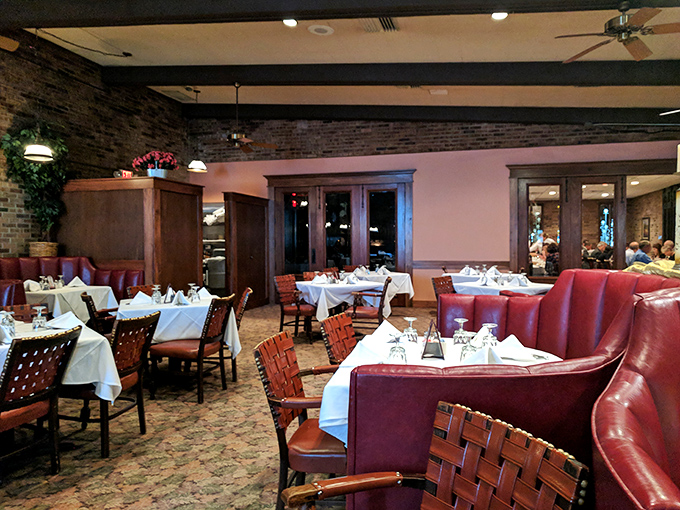 The dining room at Al's doesn't just seat you &ndash; it embraces you in burgundy booths and wooden chairs where comfort meets old-school class.