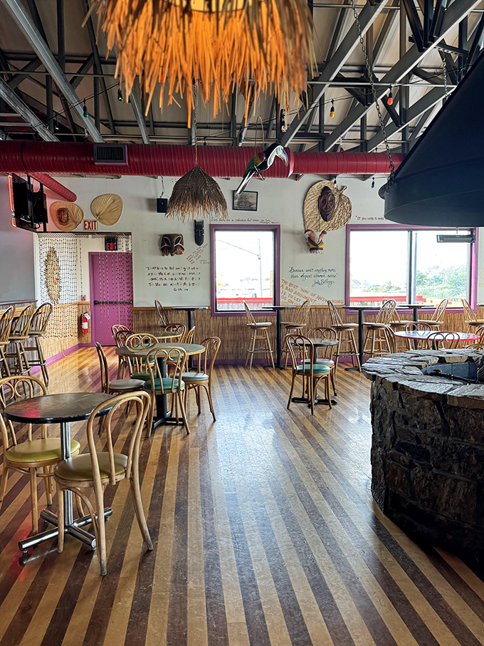 Tiki vibes meet nautical dreams in this dining room where bamboo walls whisper tales of faraway shores.