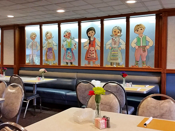 Booth seating beneath watchful Serbian folk figures&mdash;the perfect setting for making memories and unbuttoning pants after that third piece.