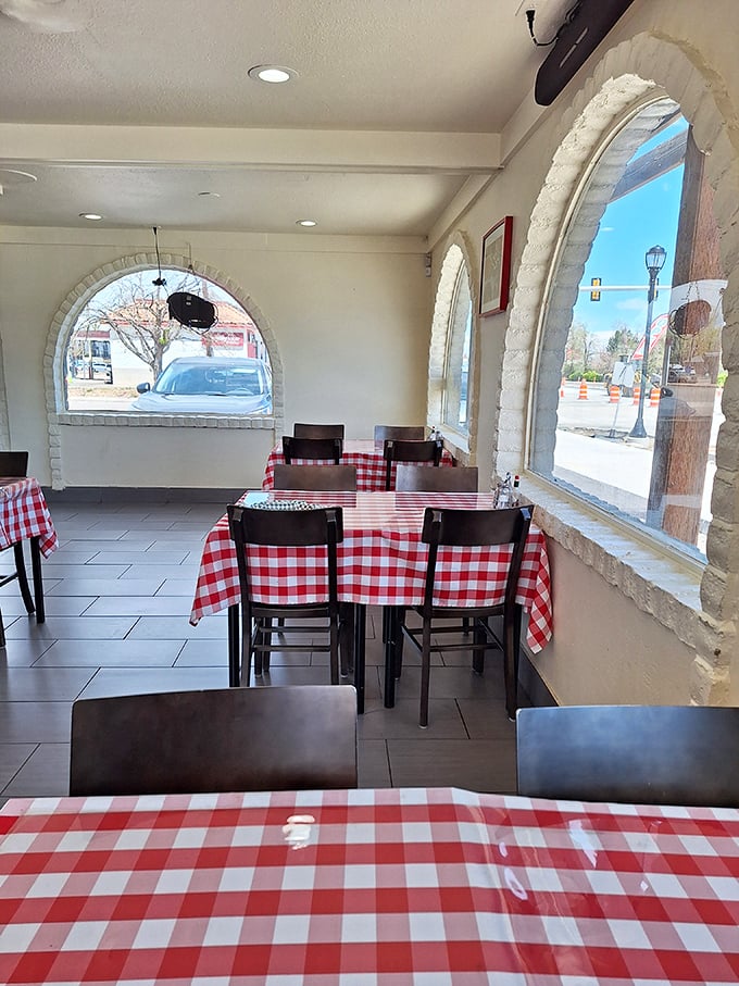 Empty tables waiting for the lunch rush&mdash;each one a stage where cheesy dramas of deliciousness will soon unfold.