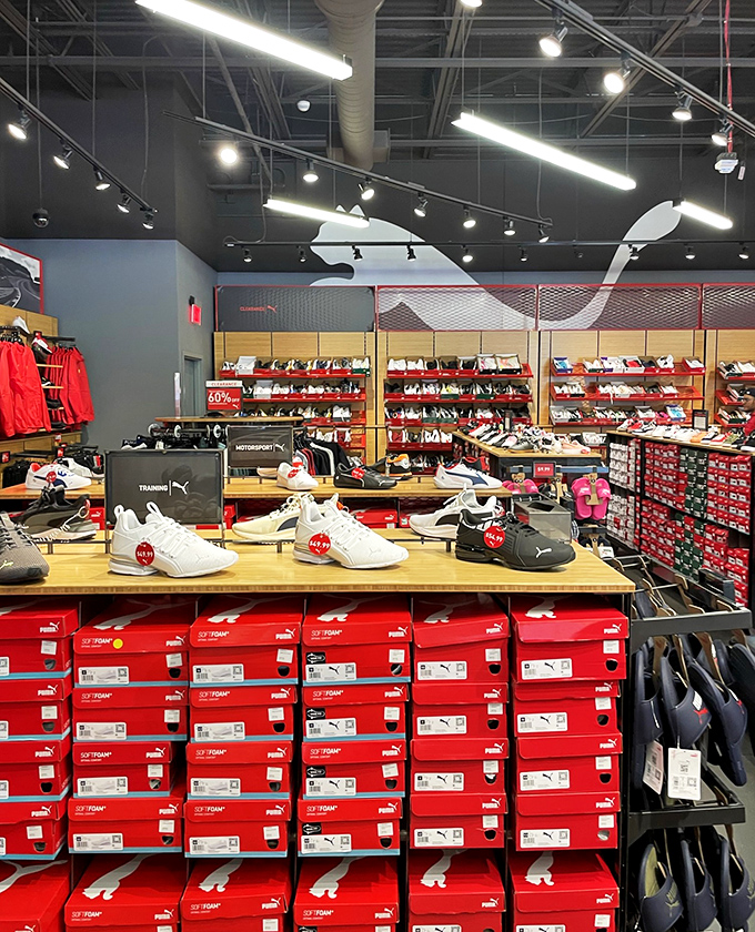 Puma's shrine to footwear, where red boxes stack like promises of faster runs, better jumps, and significantly more stylish grocery store trips.